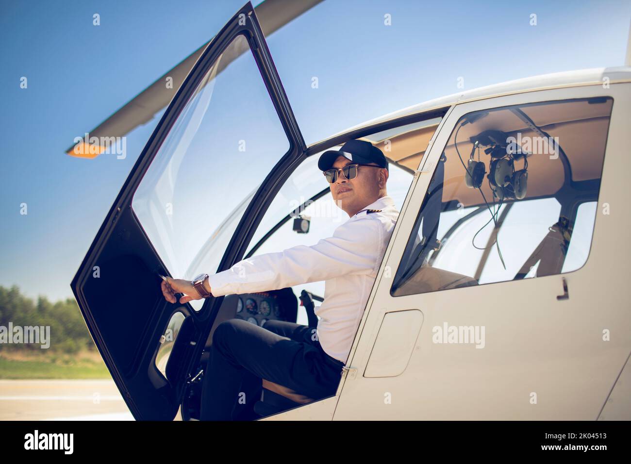 Chinese pilot sitting in helicopter cockpit Stock Photo - Alamy