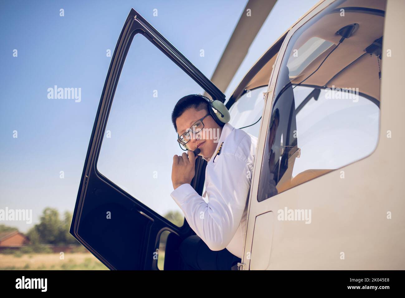 Chinese pilot sitting in helicopter cockpit Stock Photo - Alamy