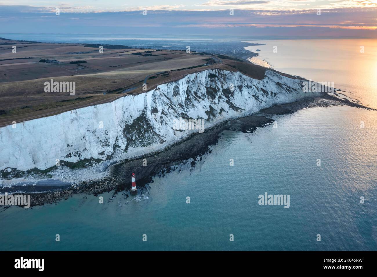 Beautiful Summer sunrise landscape image of Beachy Head Lighthouse in ...