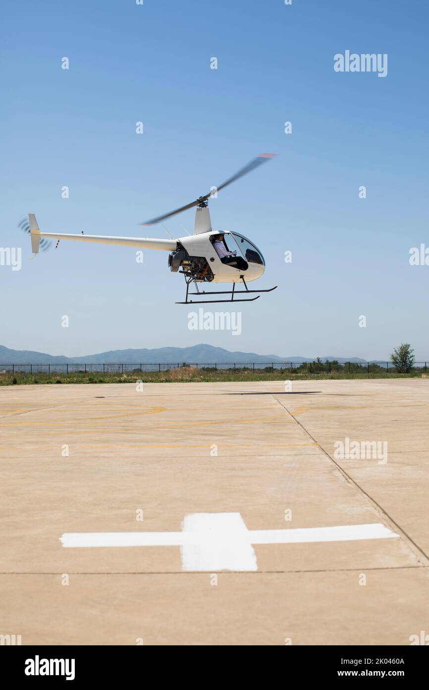 A helicopter taking off from airfield Stock Photo - Alamy