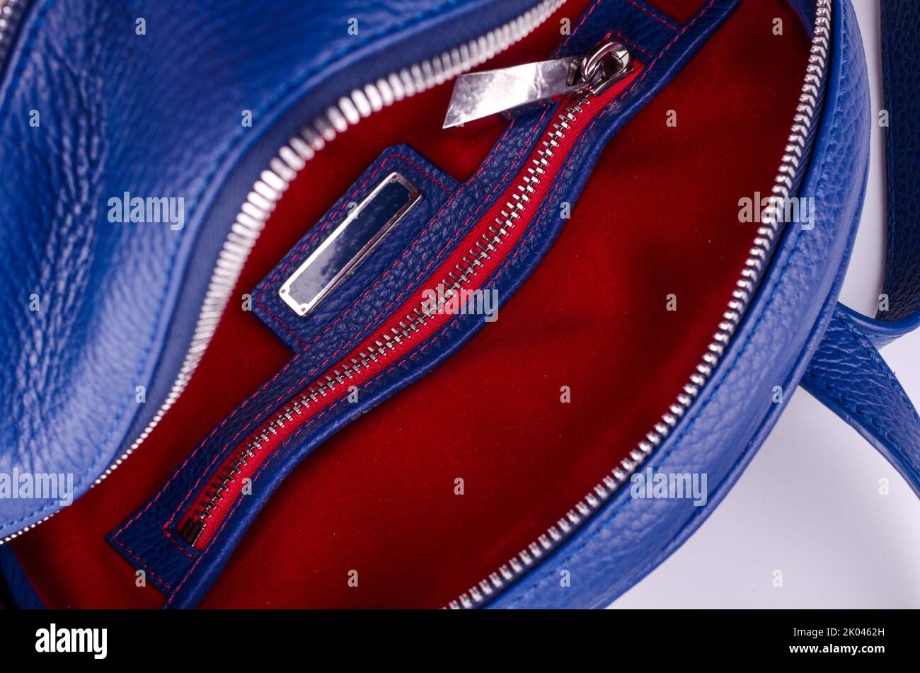 Redlining and Empty label inside blue leather backpack Stock Photo - Alamy