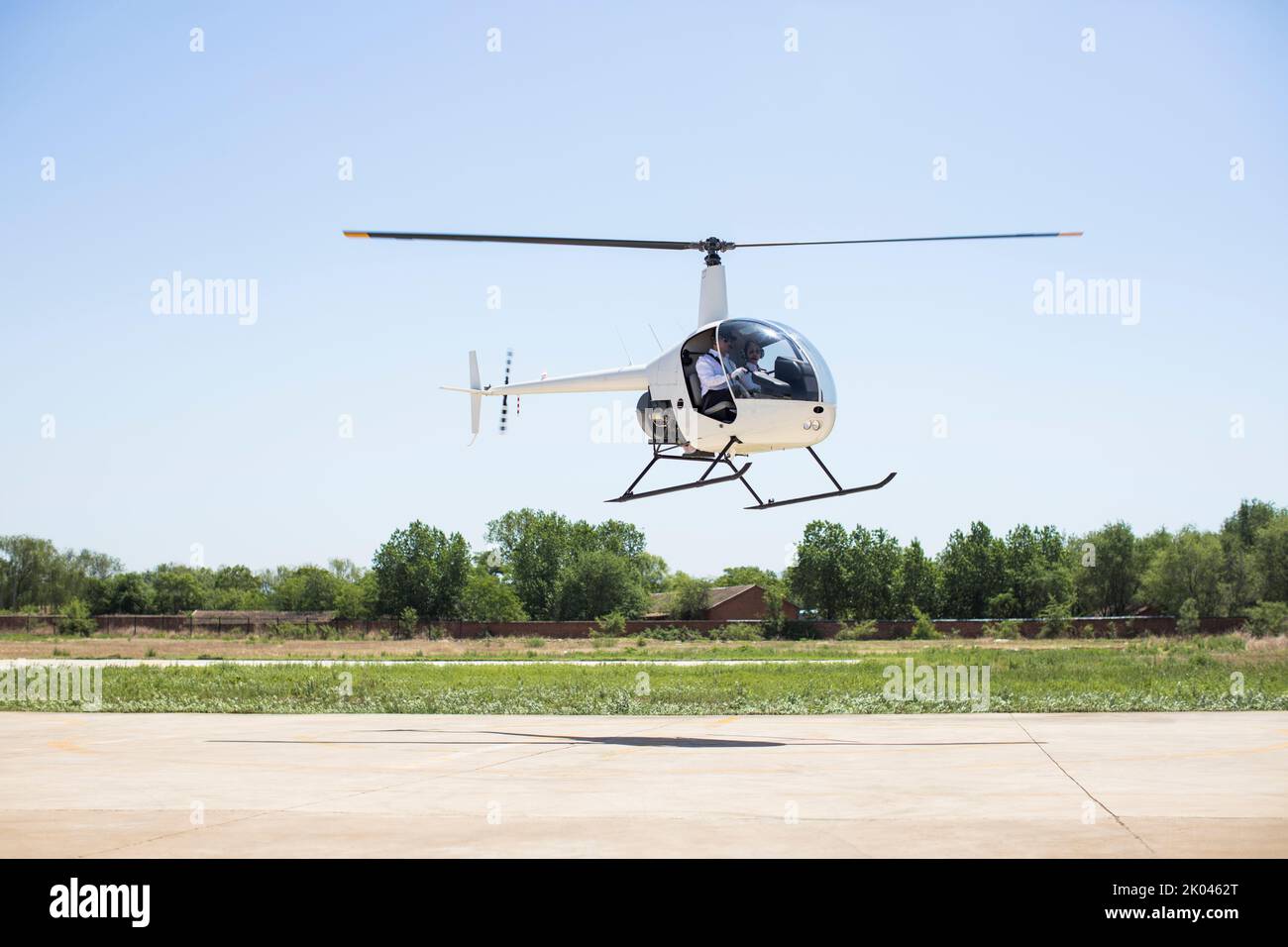 A helicopter taking off from airfield Stock Photo - Alamy