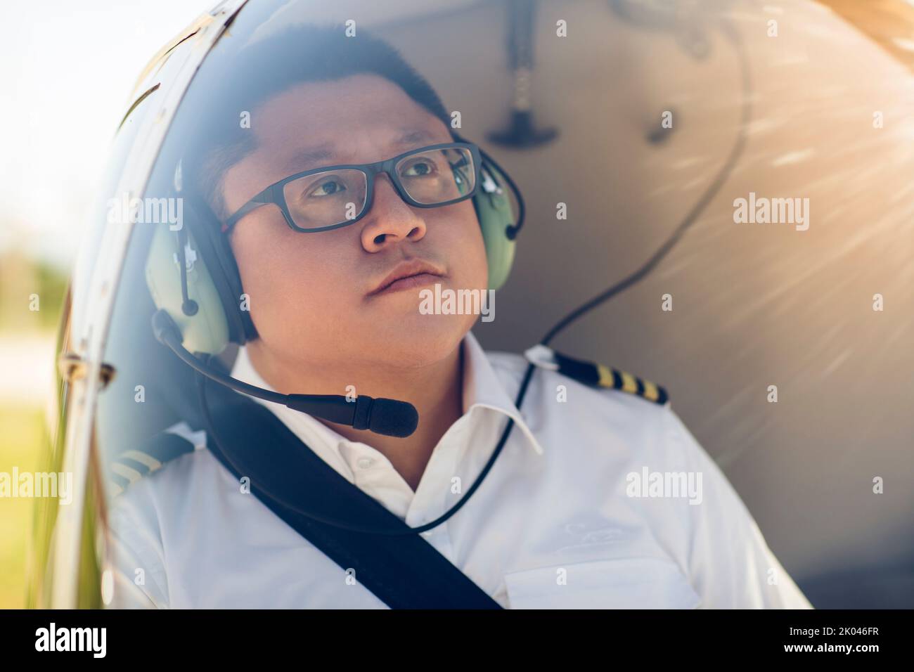 Close-up of Chinese pilot in helicopter cockpit Stock Photo - Alamy