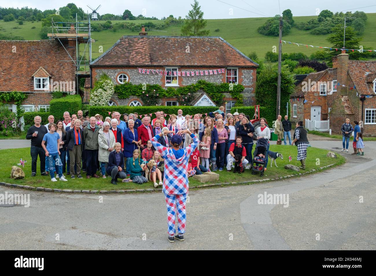 Residents of the village of Turville pose for a photograph at a Street ...