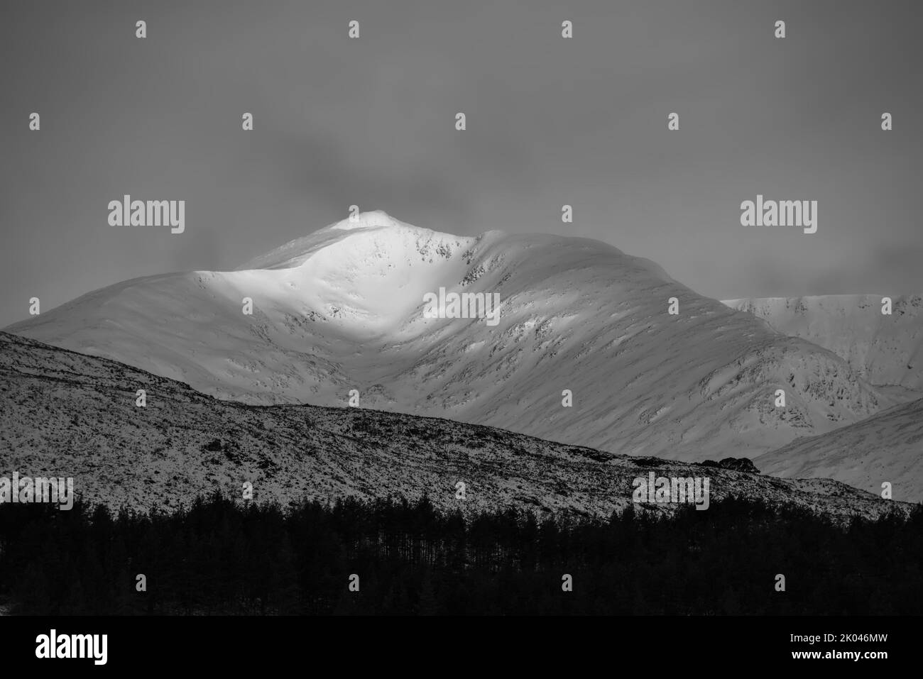 Black and white Beautiful Alpen Glow hitting mountain peaks in Scottish ...