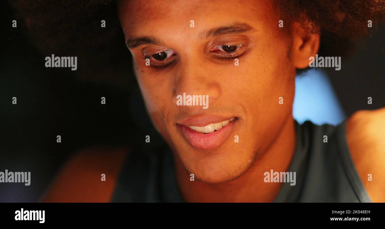 Closeup of african american mixed race man hypnotized by screen Stock ...