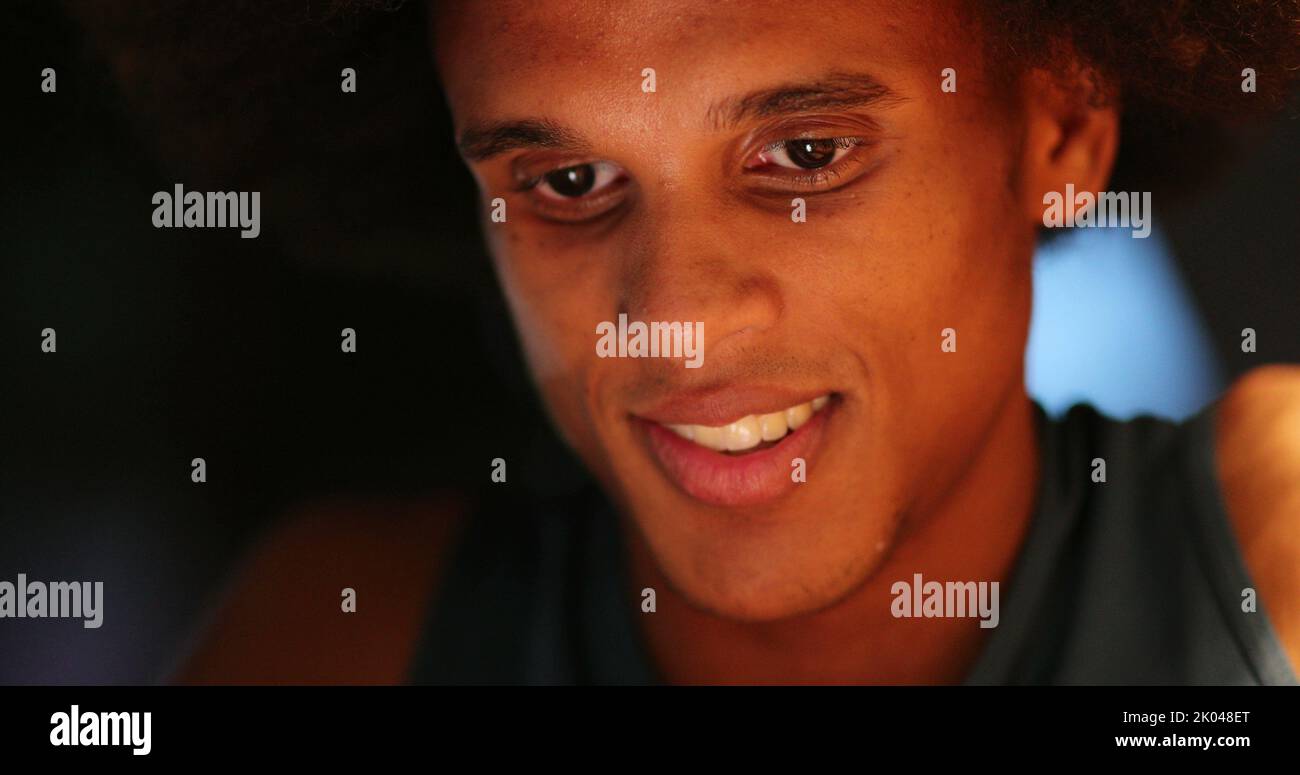 Closeup of african american mixed race man hypnotized by screen Stock ...