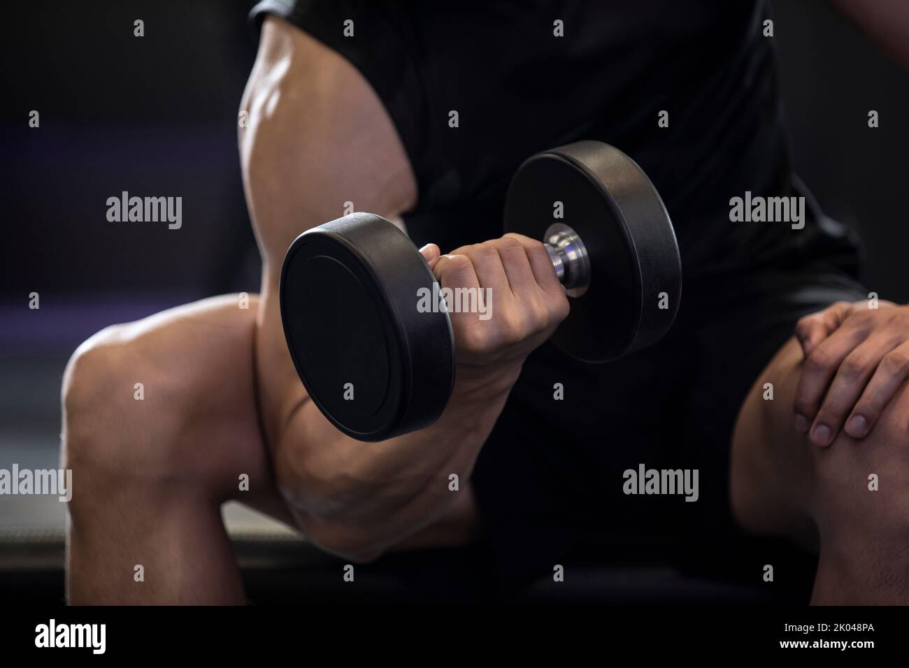 Young Chinese man working out with dumbbell at gym Stock Photo - Alamy