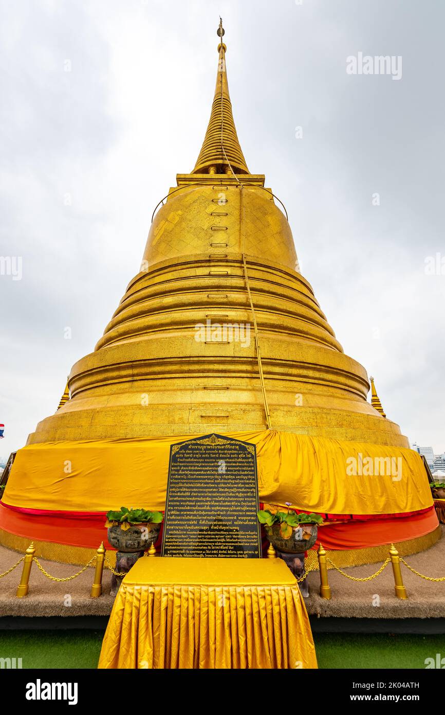 Wat Saket temple with golden stupa and angel statue. Symbol of buddhism ...