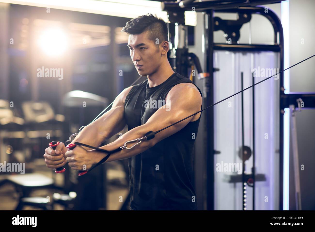 Young Chinese man exercising at gym Stock Photo - Alamy