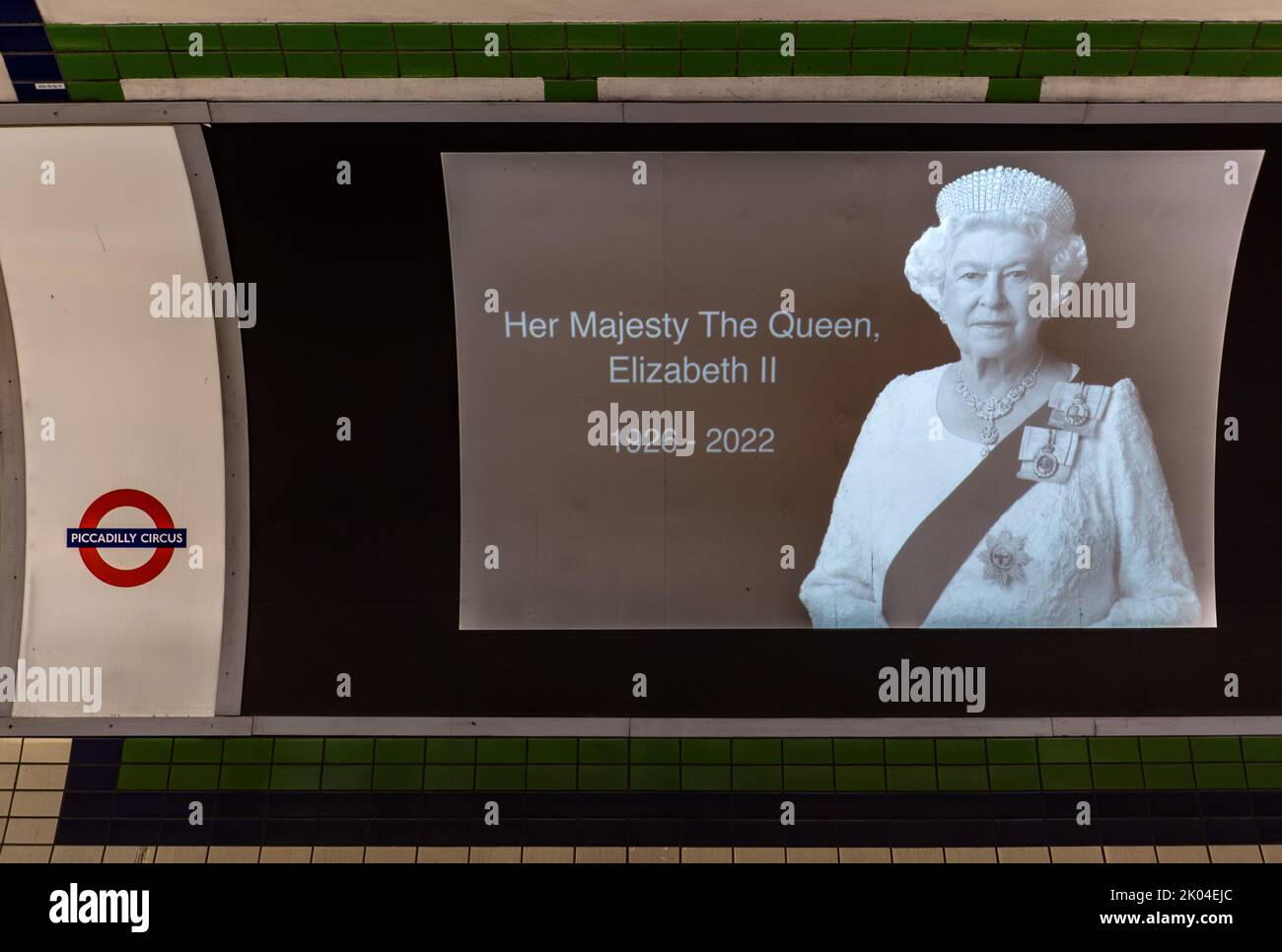 An image of Queen Elizabeth II is displayed on an electronic adverting ...