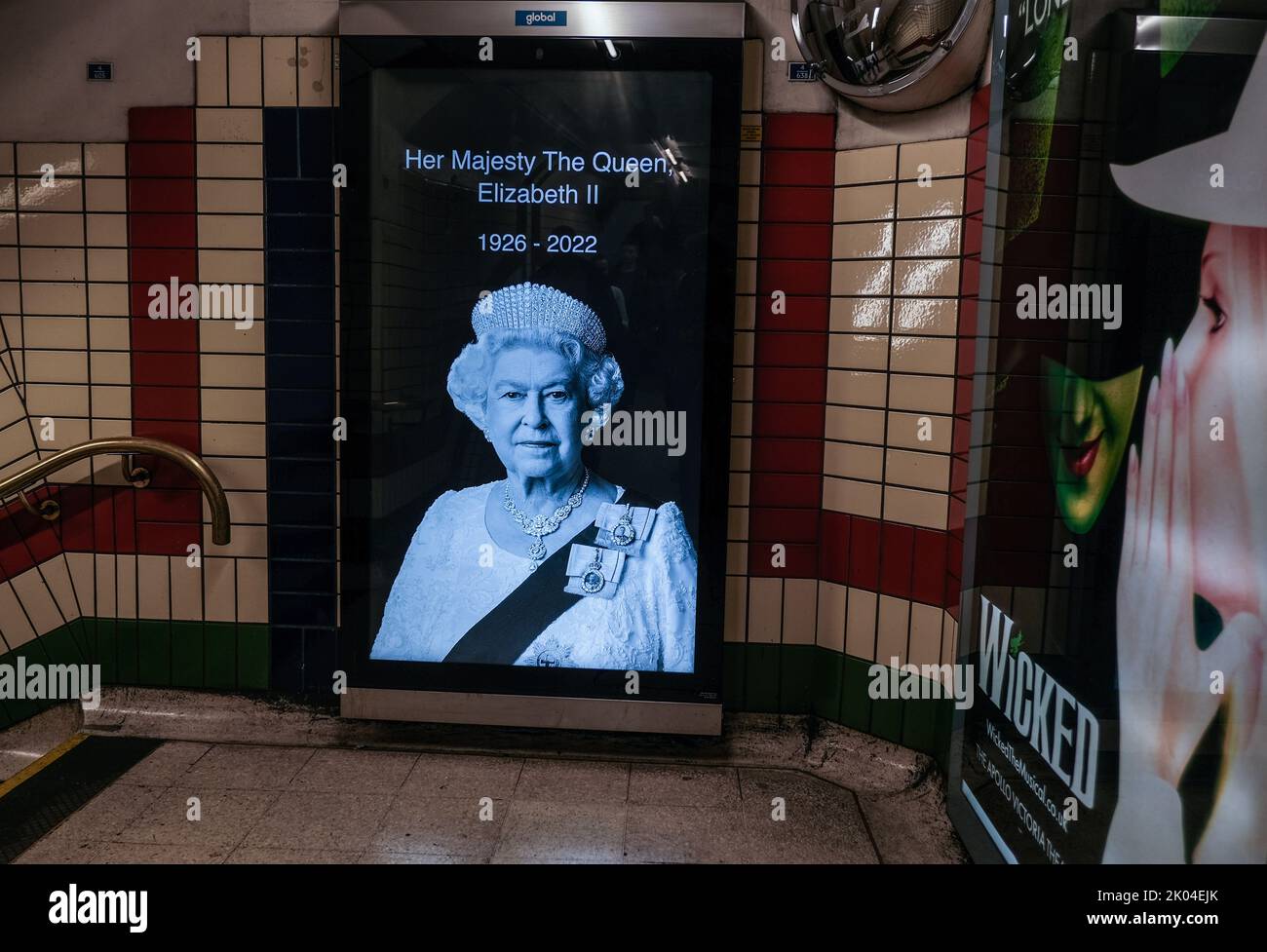 An image of Queen Elizabeth II is displayed on an electronic adverting ...