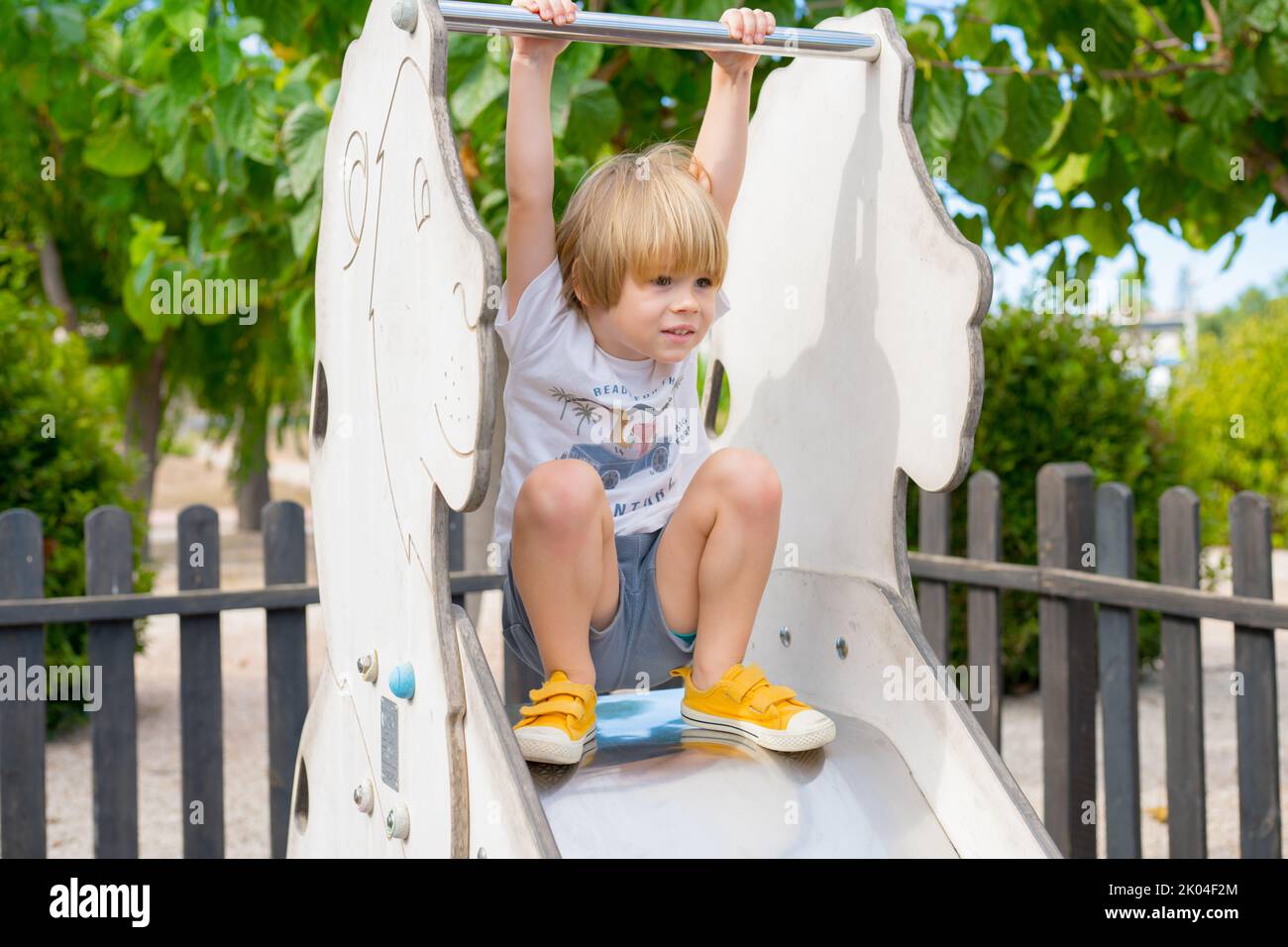 Cute 3 year old kid in a playground outdoor Stock Photo - Alamy