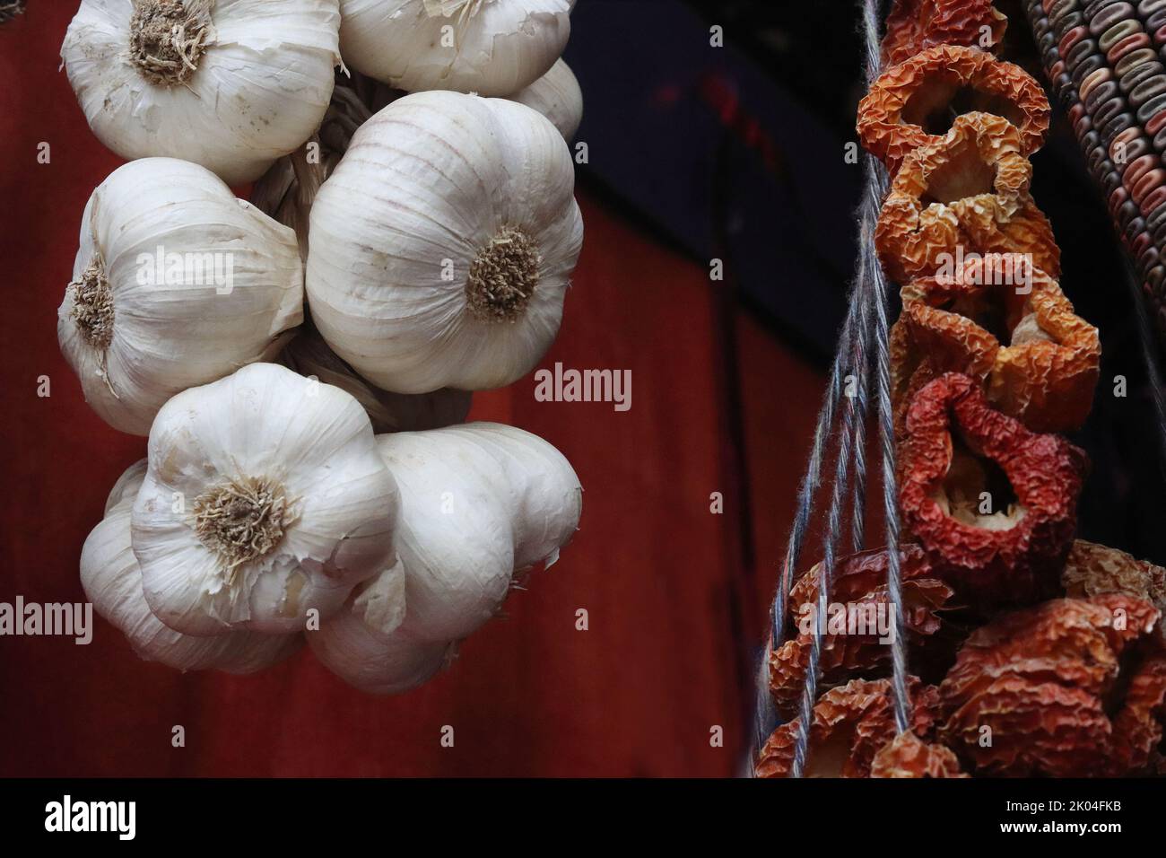 Braid of Garlic hanging in the showcase of the oriental market store in ...