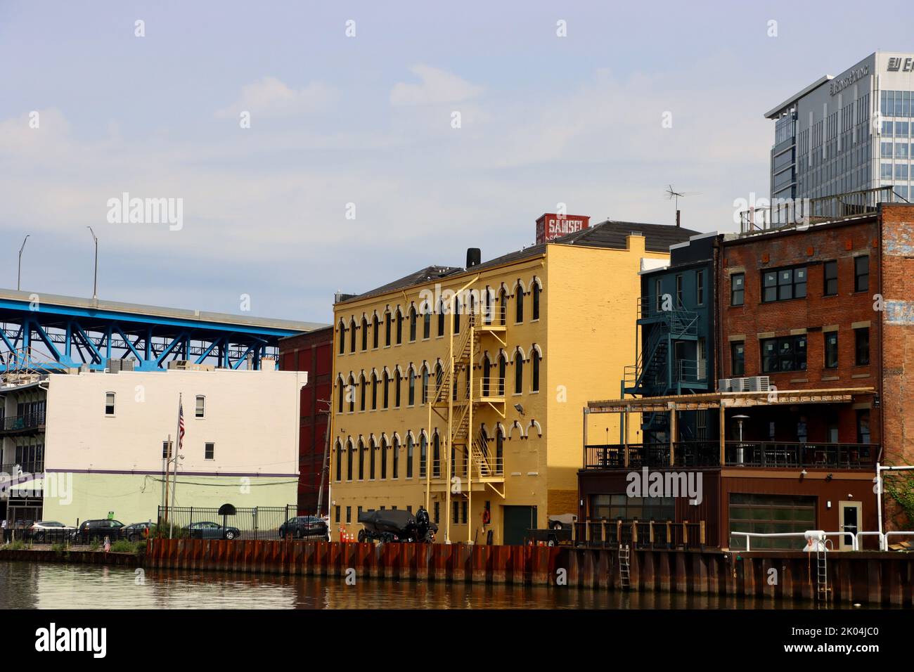 Buildings along Cuyahoga River with the Main Avenue bridge, Cleveland ...