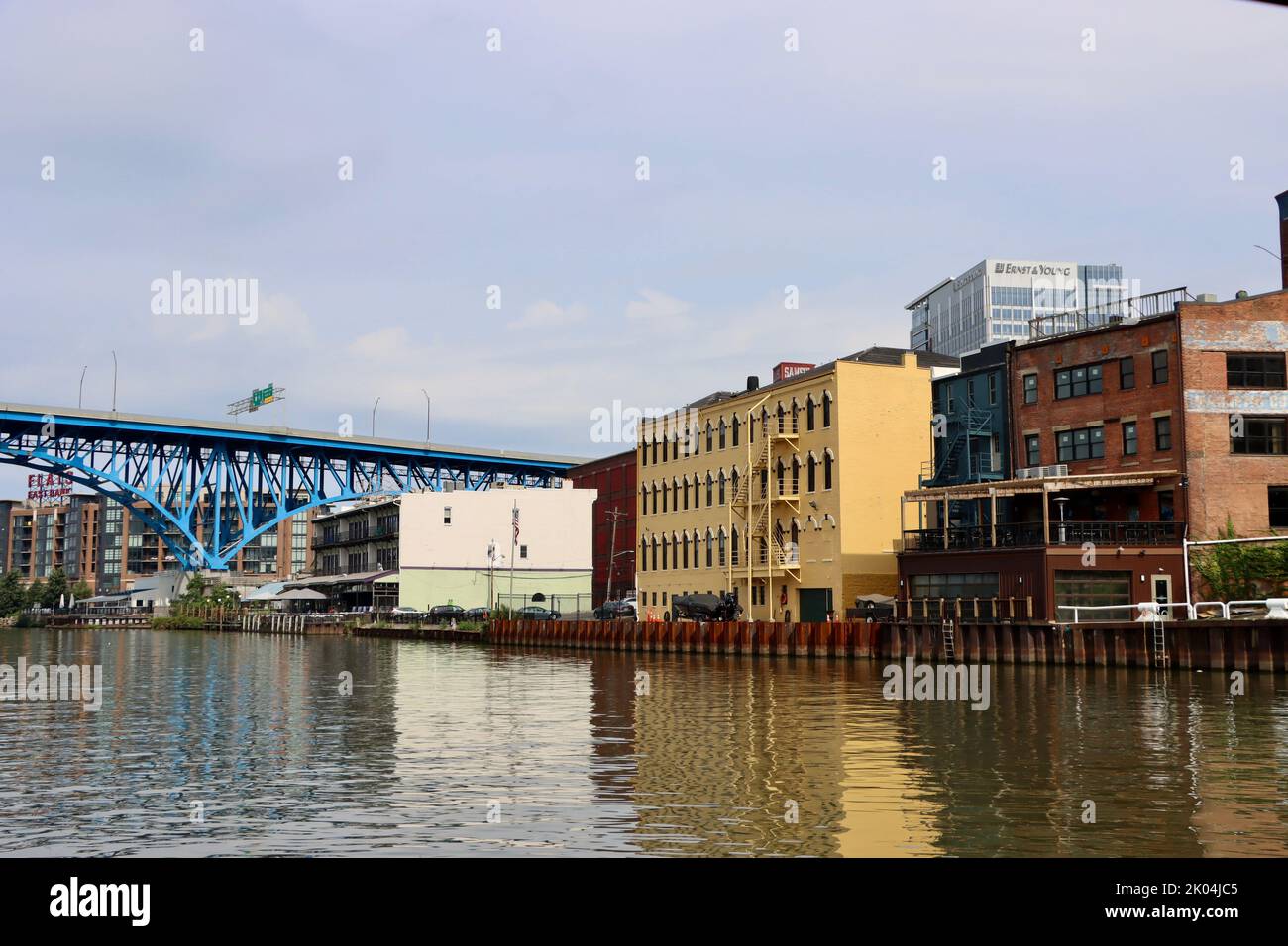 Buildings along Cuyahoga River with the Main Avenue bridge, Cleveland ...