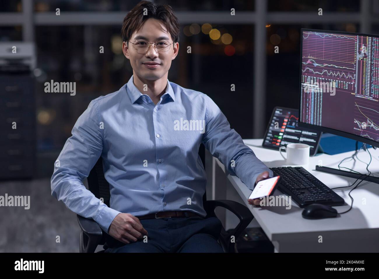 Chinese businessman working in office at night Stock Photo - Alamy