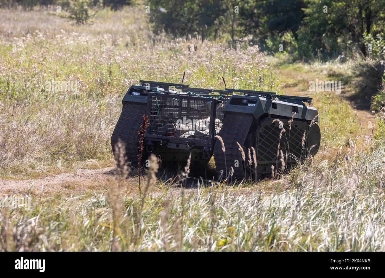 A THeMIS multi-purpose tracked drone is seen on a dusty road while ...