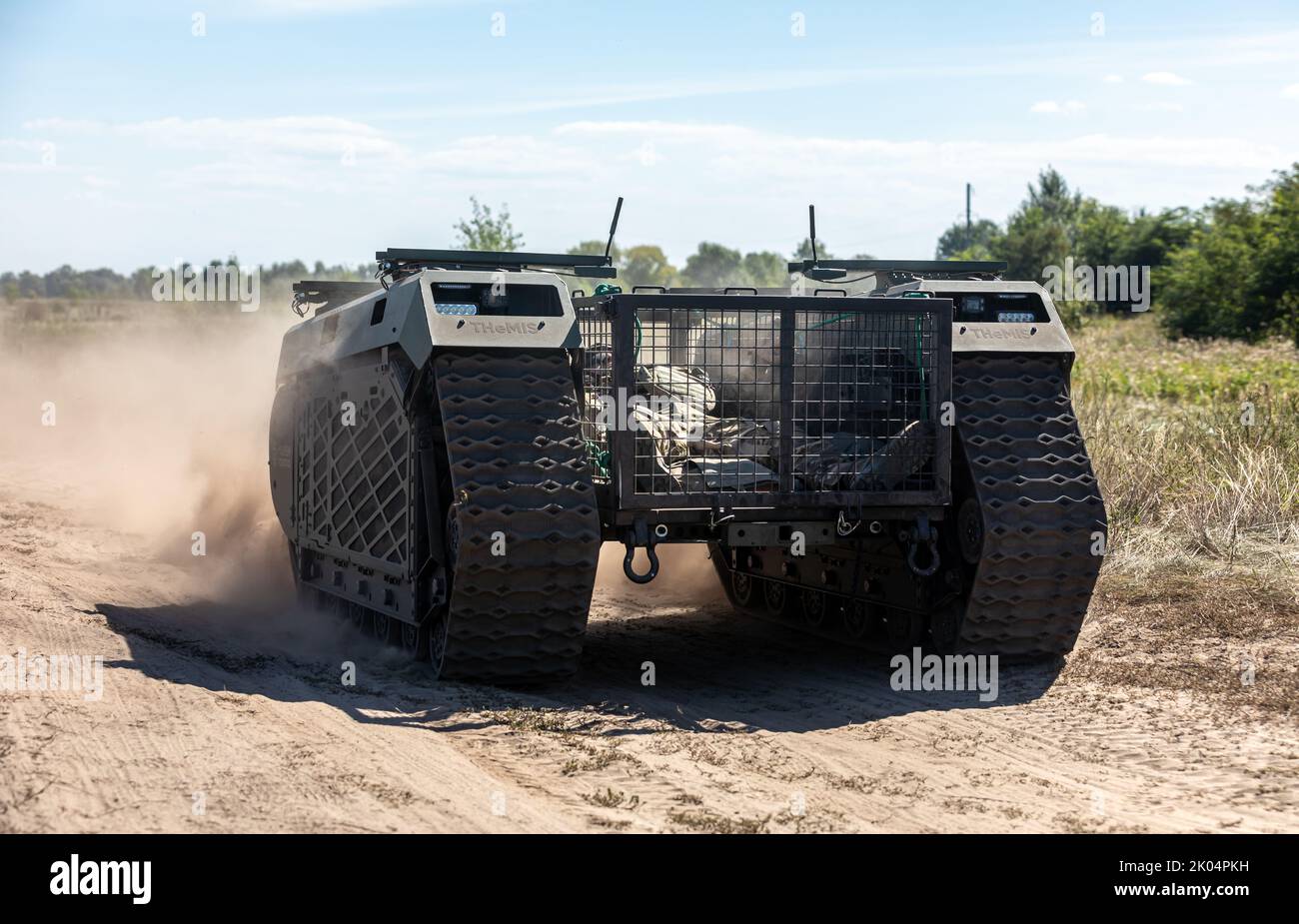 A THeMIS multi-purpose tracked drone is seen on a dusty road while ...