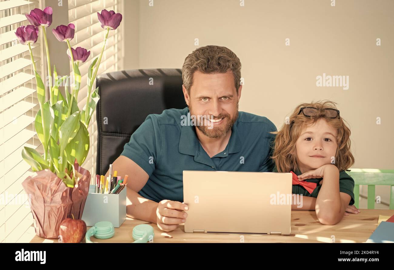 mature man teacher or dad helping kid son with school homework on ...
