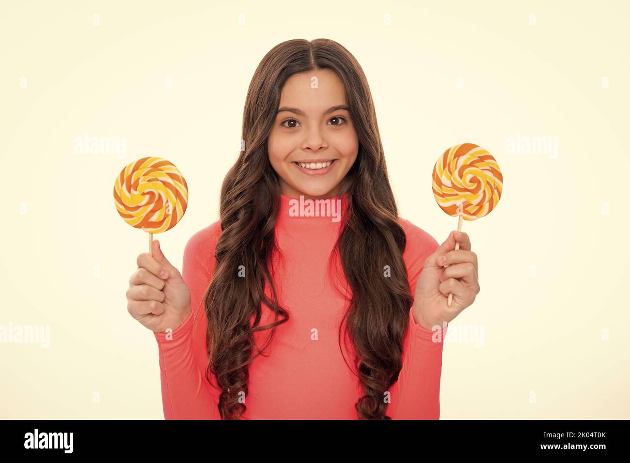 Teenager girl eating sugar lollypop. Candy and sweets for kids. Child ...