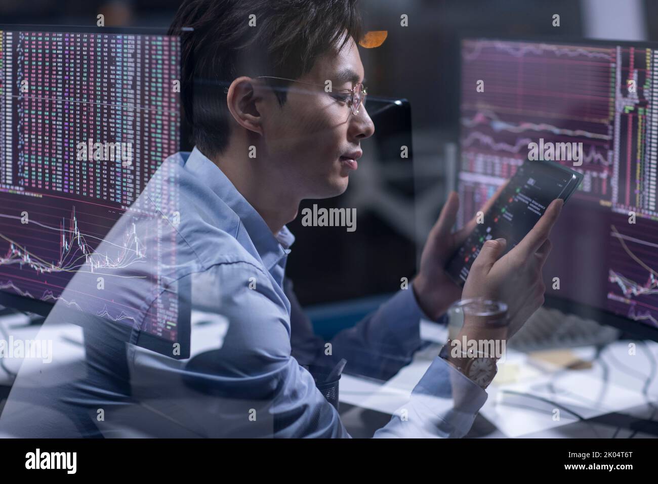 Chinese businessman working in office at night Stock Photo - Alamy