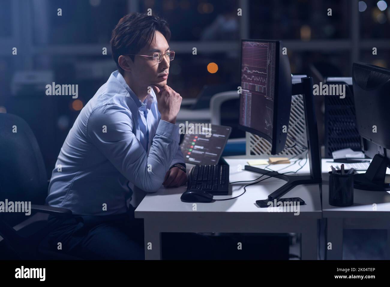 Office night businessman thinking hi-res stock photography and images ...