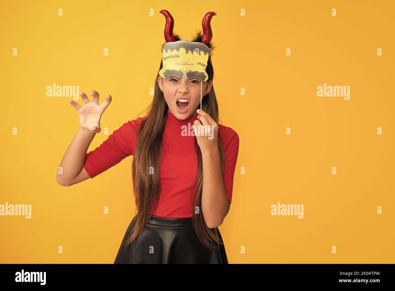 evil child in imp horns with party accessory. happy halloween. devil ...