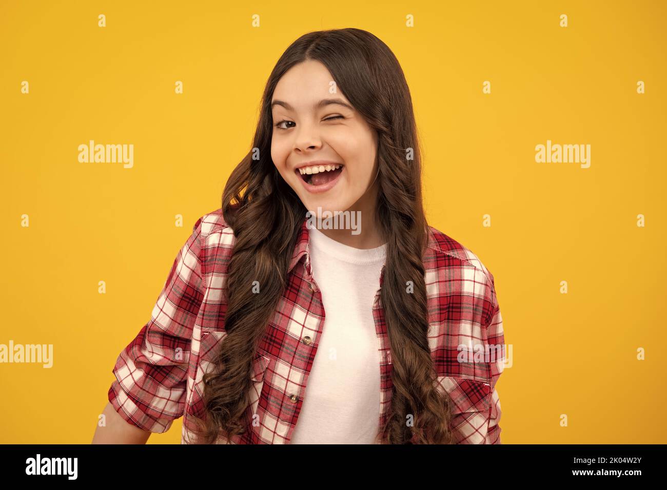 Teenager child girl close one eye, winks and smiling. Human facial ...