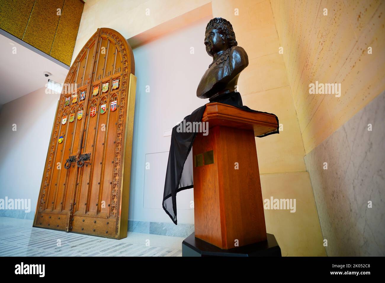 A bust of Queen Elizabeth II is draped in black fabric in the Senate ...