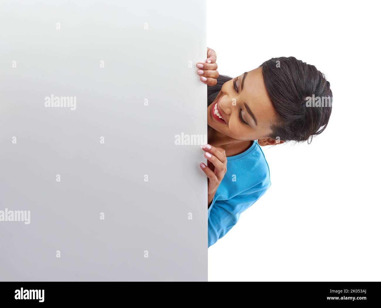 Woman looking around a corner hi-res stock photography and images - Alamy
