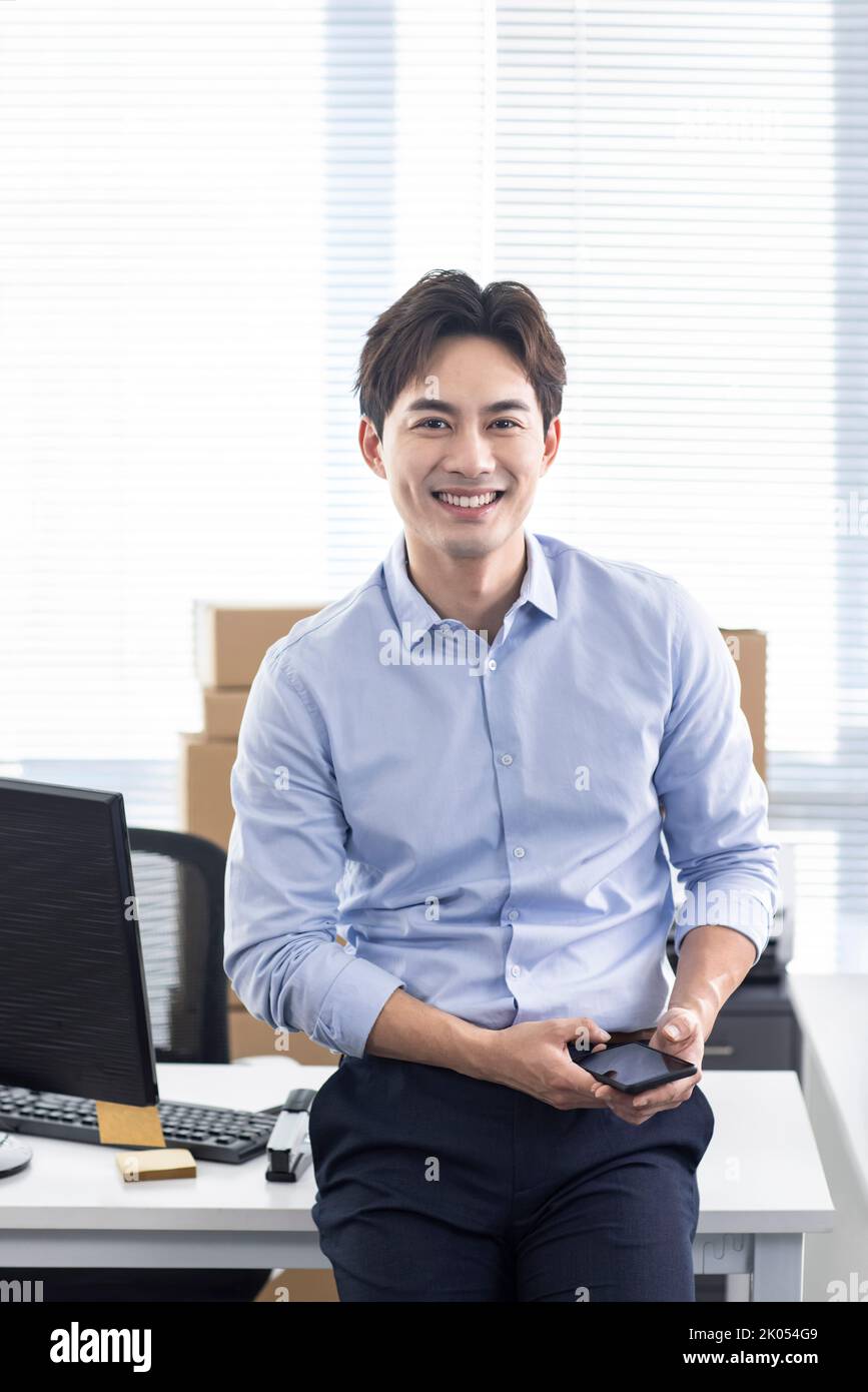 China man sitting in front store hi-res stock photography and images ...