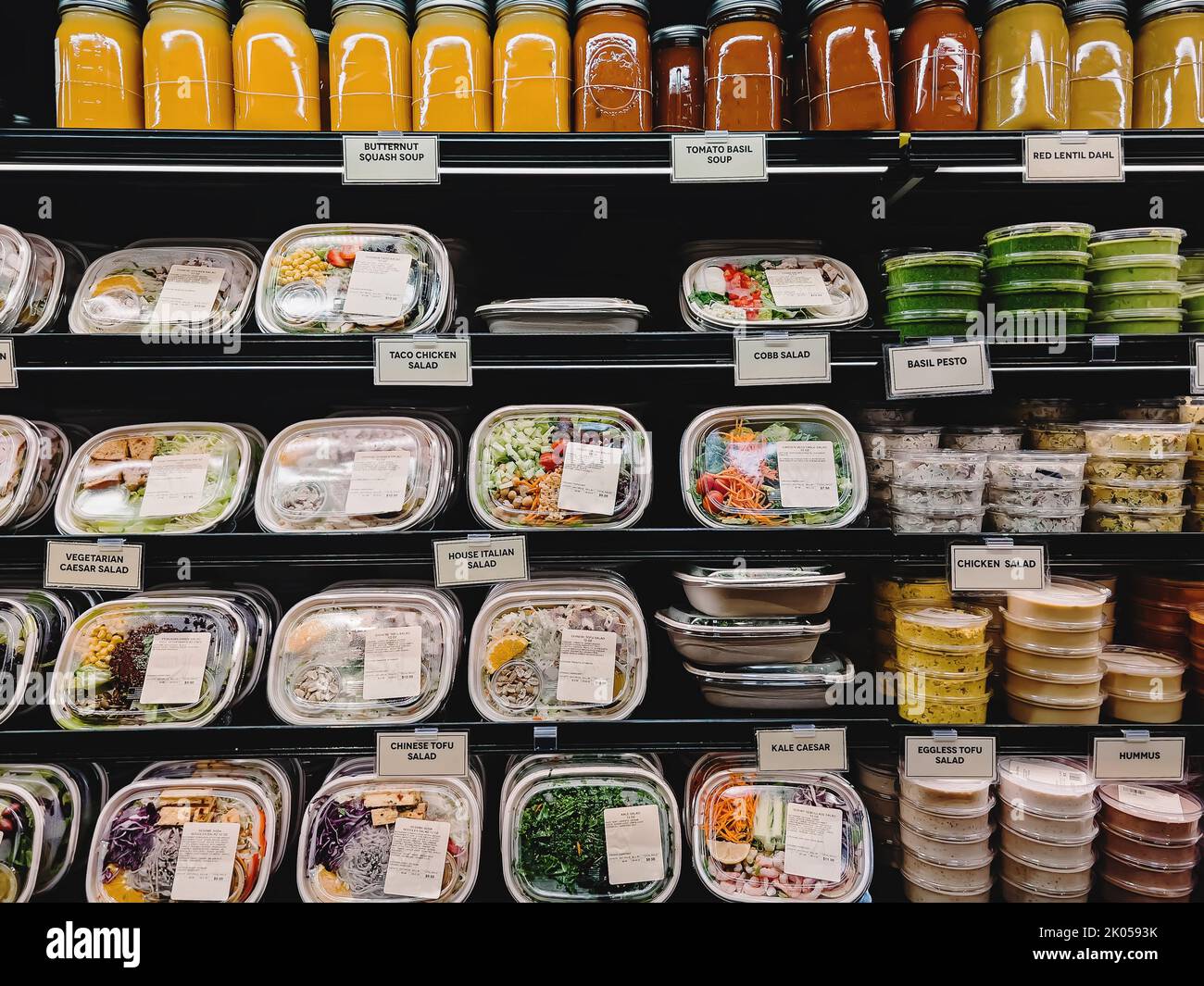 Shelves with different salads in the organic grocery store, healthy ...