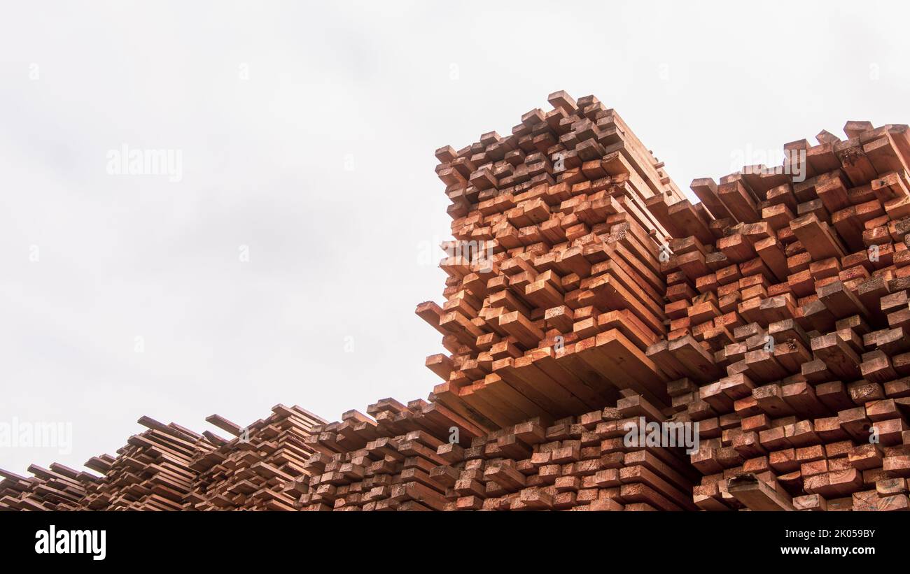 Pile of wooden blocks. Wooden boards, industrial timber building ...