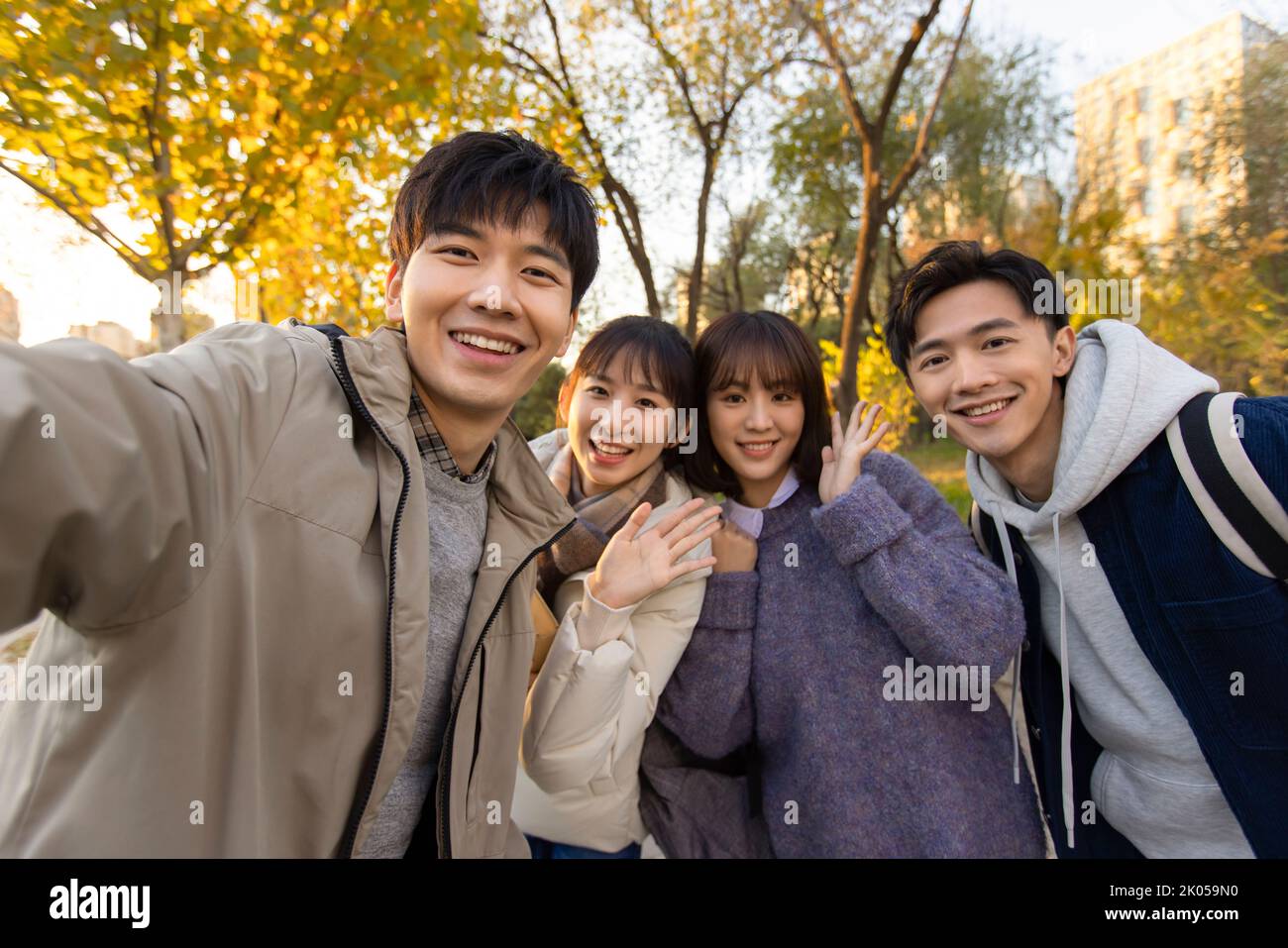 Happy Chinese college students taking selfie on campus Stock Photo - Alamy