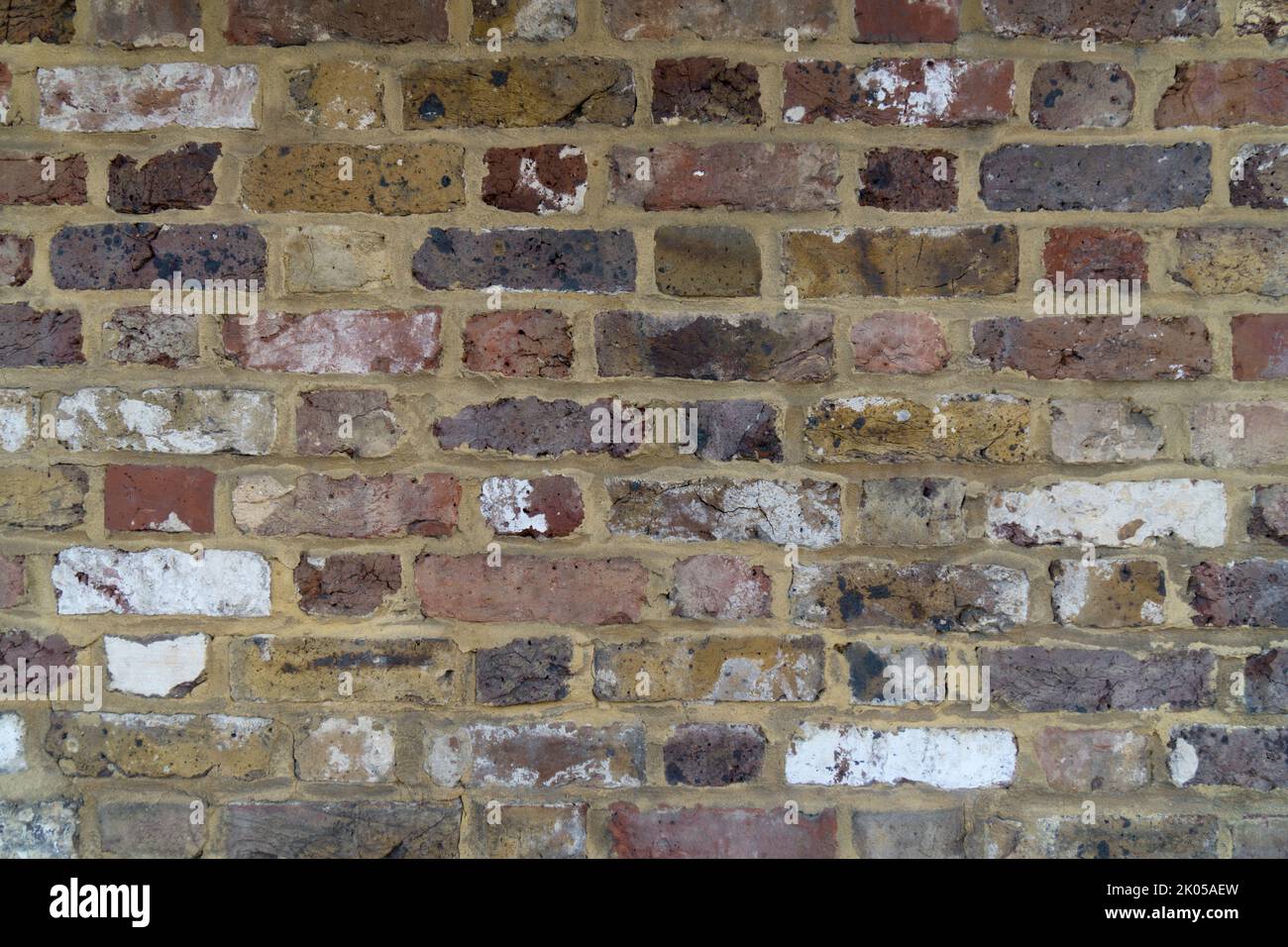 Close up stone wall several colored bricks exactly laid bricked laid ...