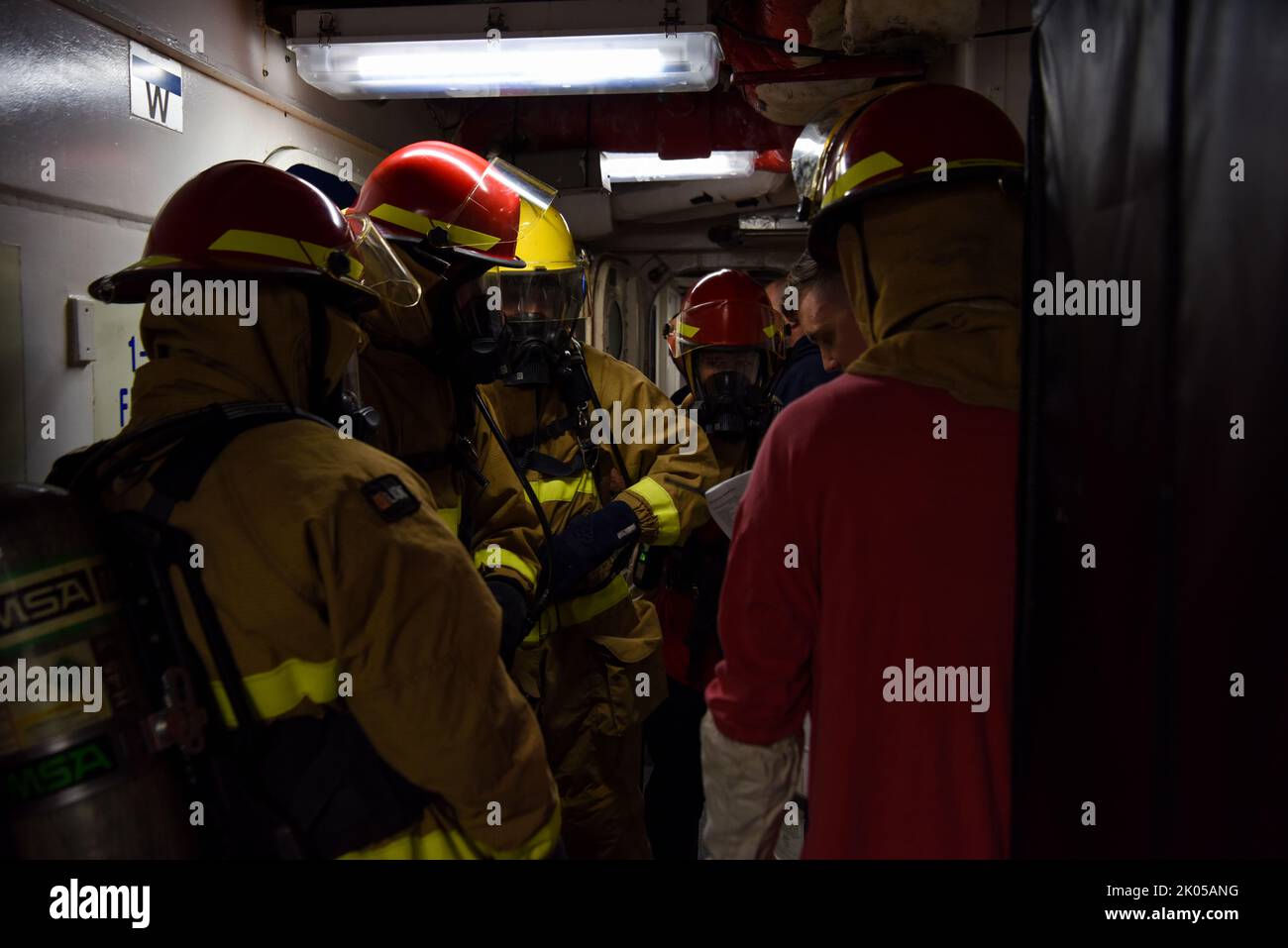 Crew members onboard the USCGC Mohawk (WMEC 913) dress out in ...