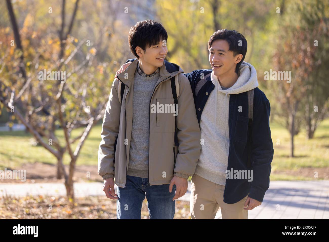Two men students talking on campus hi-res stock photography and images ...