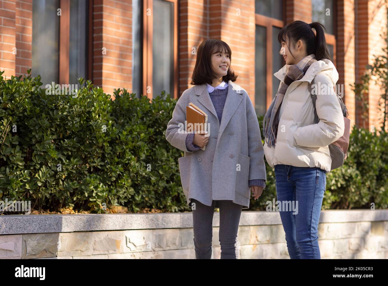 Happy Chinese college students on campus Stock Photo - Alamy
