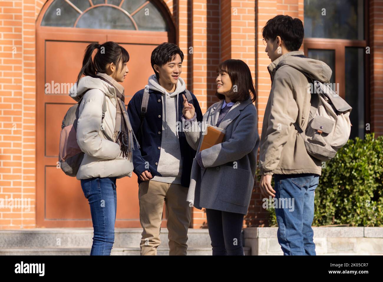 Three college students standing talking hi-res stock photography and ...