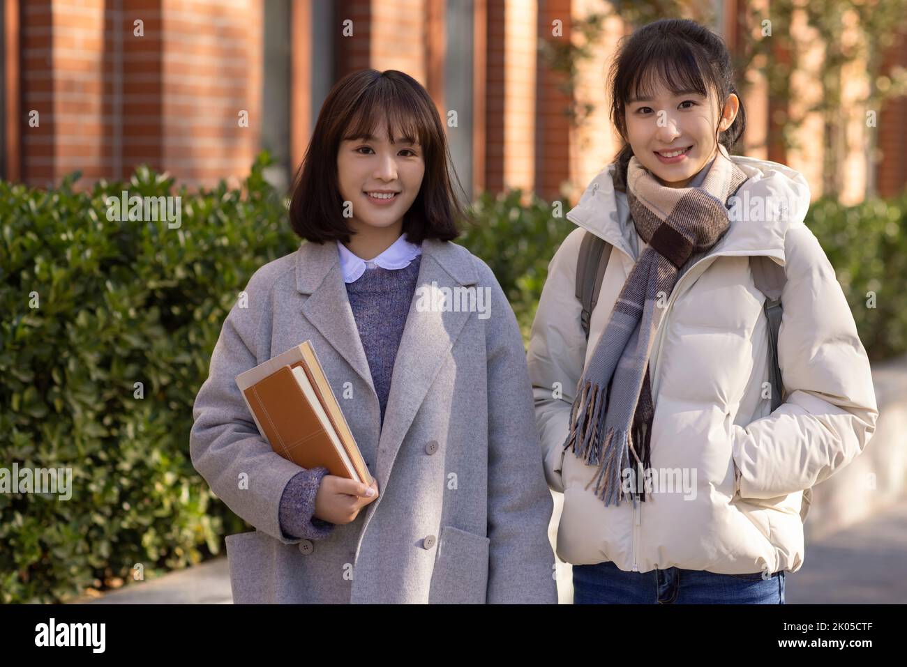 Happy Chinese college students on campus Stock Photo - Alamy