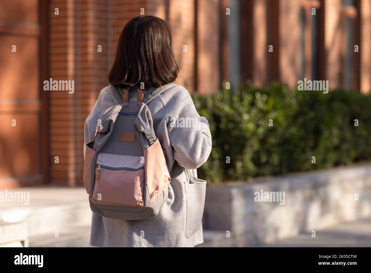 Chinese college student walking on campus Stock Photo - Alamy