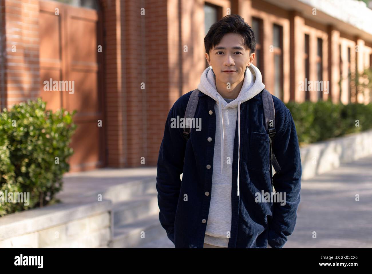 Happy Chinese college student on campus Stock Photo - Alamy