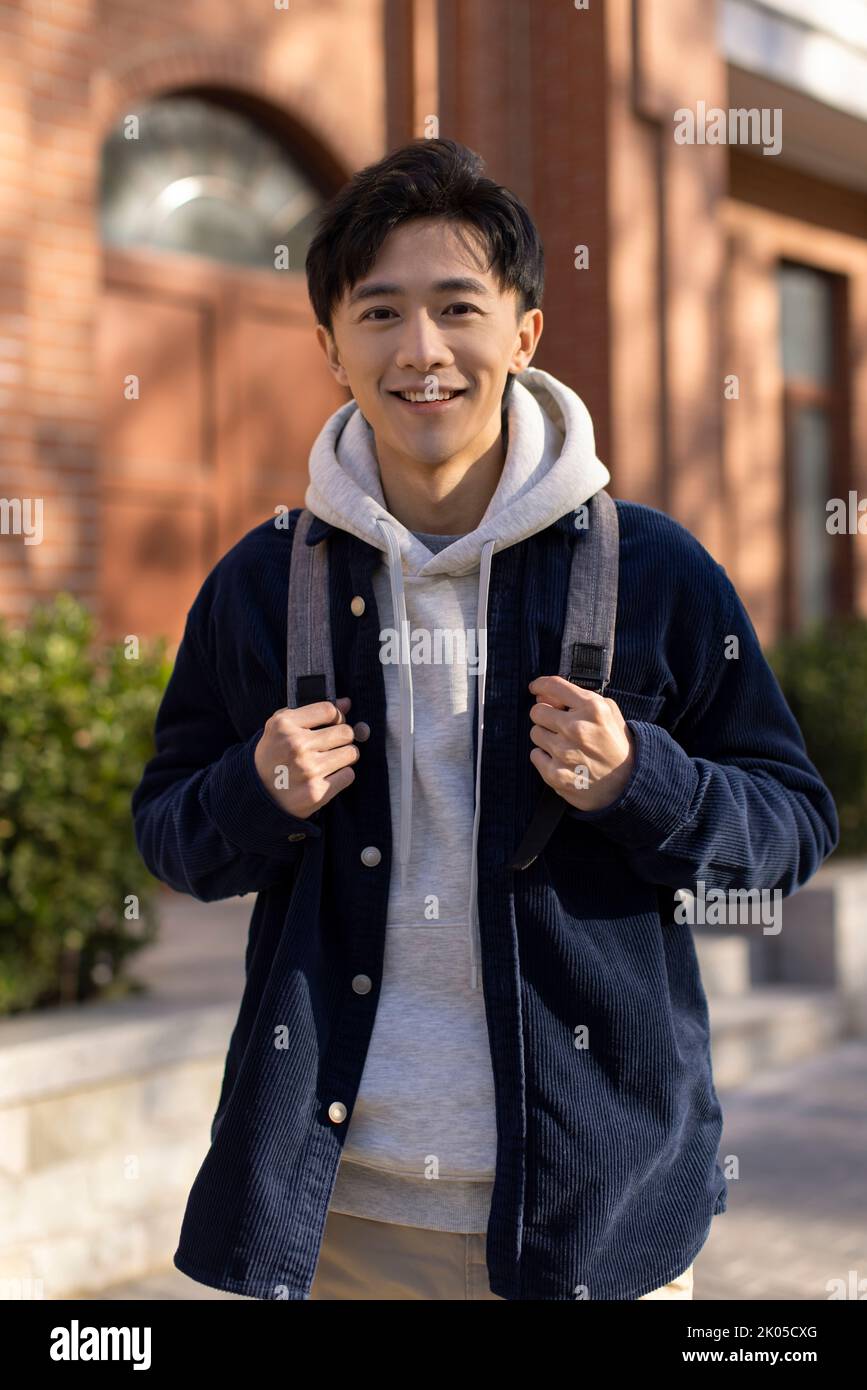 Happy Chinese college student on campus Stock Photo - Alamy