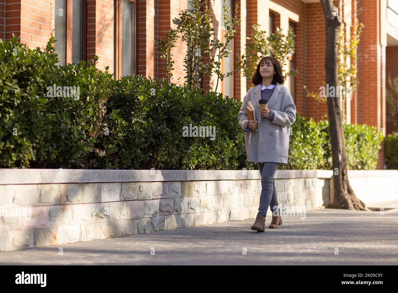 Happy Chinese college student on campus Stock Photo - Alamy