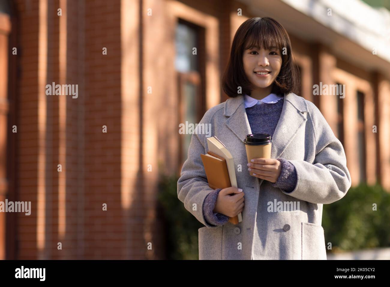 Portrait of cheerful Chinese college student Stock Photo - Alamy