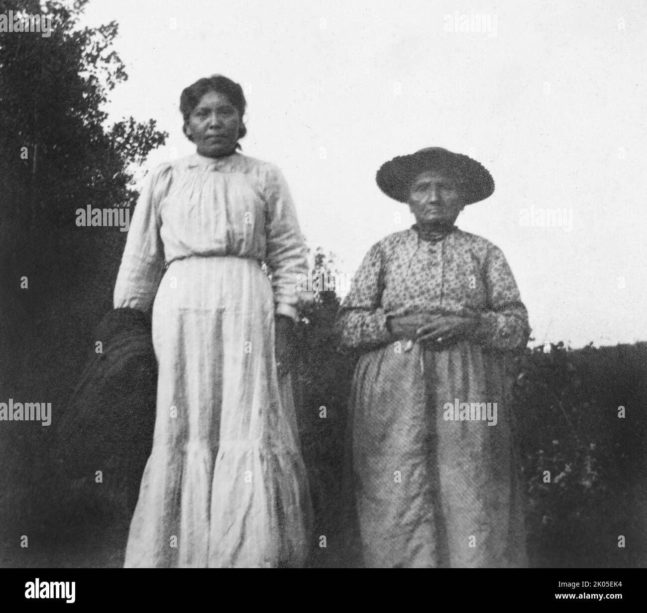 Two mature Native American women stand for a portrait in Northern ...