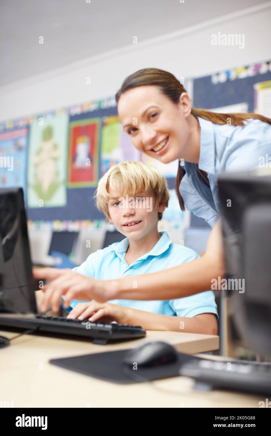 Showing him some computer shortcuts. Portrait of an attractive young ...