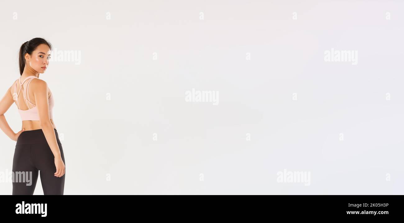 Full length of focused and motivated young asian girl with slim perfect ...