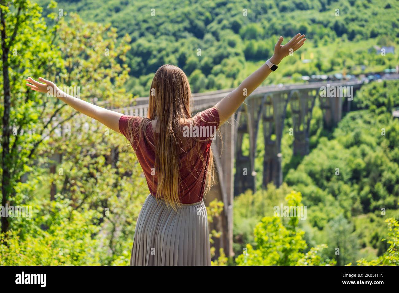 Montenegro. Woman tourist in background of Dzhurdzhevich Bridge Over ...